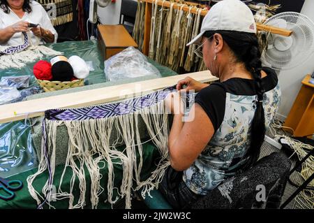 Hand-weaving Maori clothes using materials from the land at Te Puia ...