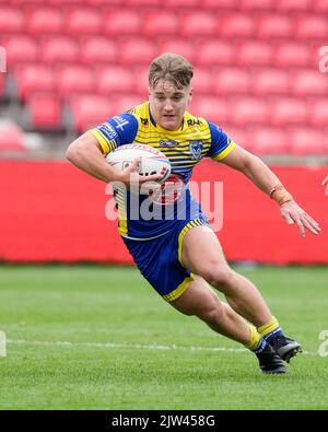 Leon Hayes #39 of Warrington Wolves and Danny Walker warm up before the ...