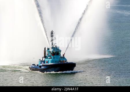 Lomax Fire Fighting Vessel tug water saluting cruise ship Stock Photo ...