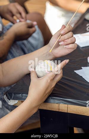 Hand painting stone with brush . Indian flag color with " amar Jawan ...