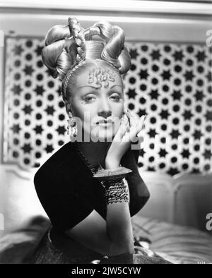 MARLENE DIETRICH and Costume Supervisor IRENE on set candid during ...