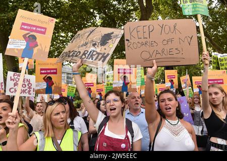 Protesters hold placards expressing their opinion during the ...