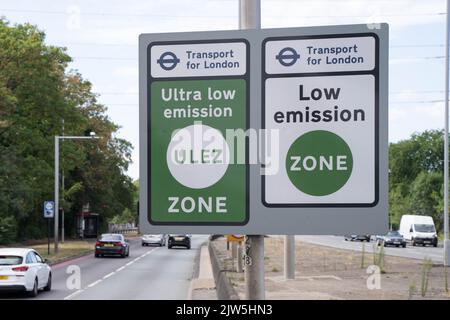 vehicles driving pass TFL signages for ULEZ - Ultra Low Emission Zone ...