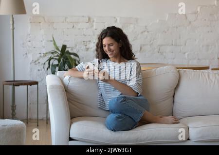 Young beautiful hispanic woman ecommerce business worker scanning ...