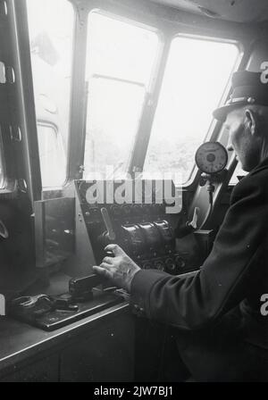 Image of a driver in the steering position of the Electric train set no ...