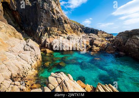 The amazing rock pools at Rinsey beach. Clear aqua tropical water pools ...
