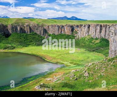 lost lake surrounded by cliffs in the shonkin sag glacial outflow ...