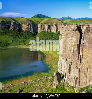 lost lake surrounded by cliffs in the shonkin sag glacial outflow ...