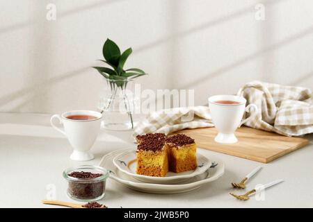 Sliced Mocca Cake with Chocolate Sprinkle Topping, Served with Tea ...
