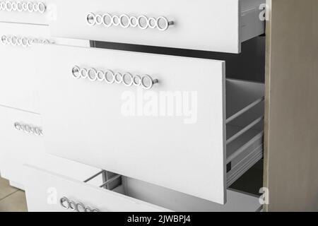 Open empty drawers in kitchen, closeup Stock Photo - Alamy