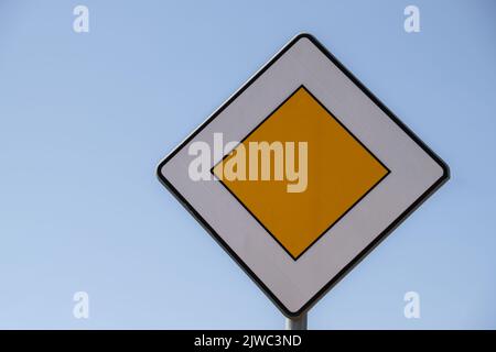 International road signs 'Main road' or 'Priority road' in a row. Many ...