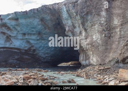 Entrance of ice cave carved into the Vallelunga glacier crossed by a ...