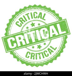 CRITICAL text written on green grungy stamp sign Stock Photo - Alamy