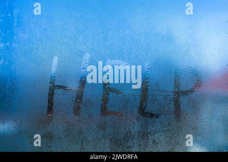 Fogged glass, a question mark is written on the window with ...