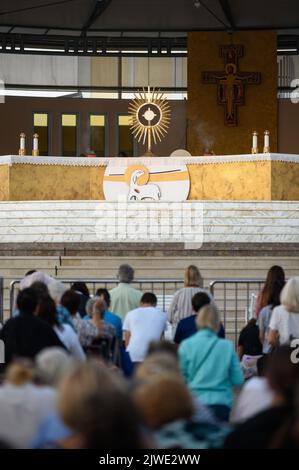 Pilgrims kneel in prayer after reaching the final of the 14 Stations of ...