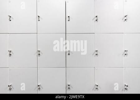 Large gray locker with each locker closed located beside corridors ...