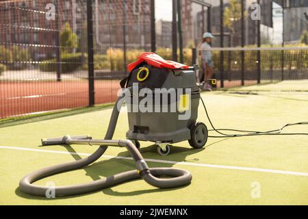 Sand tennis court sweeper cleaning court lines Stock Photo - Alamy