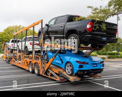 Large two level car carrier with cars and trucks ready for delivery in ...