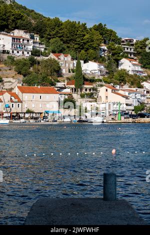 Mimice, Croatia-August 16th, 2022: Houses built on the steep slope of ...