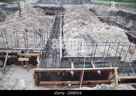 Trench for concrete foundation is reinforced with steel bars rebar ...