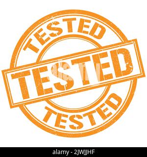 TESTED text written on orange lines stamp sign Stock Photo - Alamy