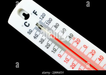 26 Celsius and 80 Fahrenheit degrees on a thermometer on black ...