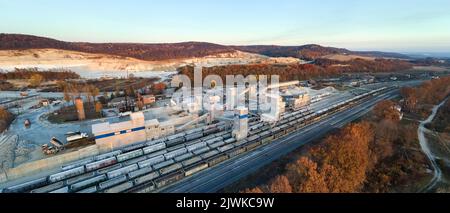 Aerial view of cargo train loaded with crushed sandstone materials at ...