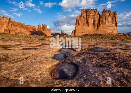 Clouds reflected in an ephemeral rainwater pool in the Courthouse ...