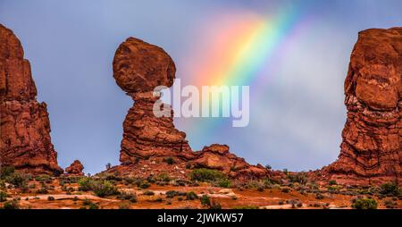 A rainbow behind Balanced Rock in Arches National Park, Moab, Utah ...