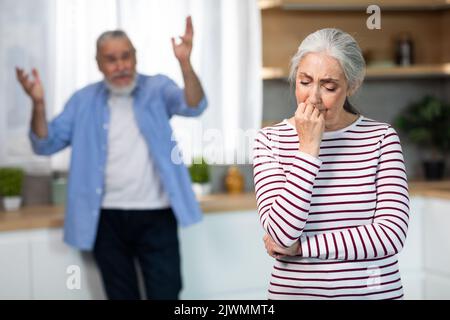 Psychological Abuse. Upset Senior Woman Crying In Kitchen While Arguing ...