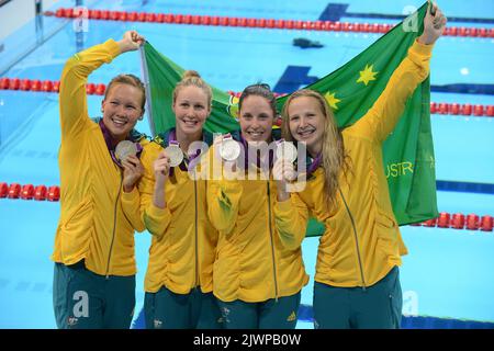 Australia's Kylie Palmer, Bronte Barratt and Stephanie Rice, top from left, celebrate with final ...