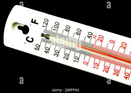 15 Celsius and almost 50 Fahrenheit degrees on a thermometer on black ...