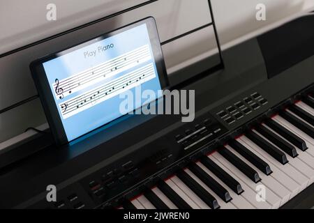 Mixing music on tablet with electronic music instruments concept Stock ...
