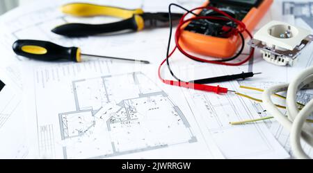 Making repairs,planning electricity project in house.Drawings,diagrams ...