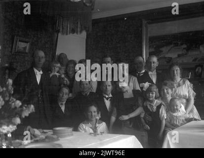 The man in the middle is Carl Nordgren, who probably sits with Eva ...