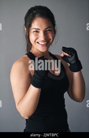 Always up for a fitness challenge. Studio shot of a sporty young woman ...