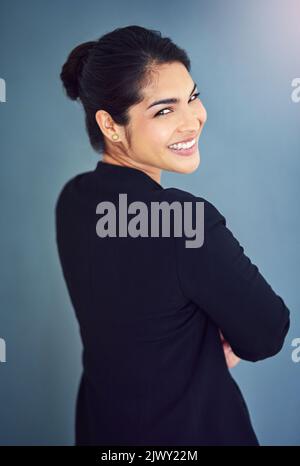 Confidence is the key to success. Studio portrait of an attractive ...