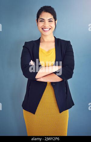 Confidence is the key to success. Studio portrait of an attractive ...