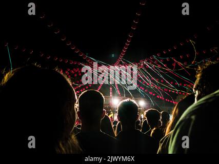 Live music performance decorated with paper lanterns and streamers ...