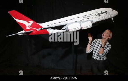 Lego enthusiast Angela Ceberano looks on at a Qantas A380 jet, one of ...