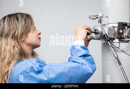 Transmission electron microscope sample holder been loaded with an ...