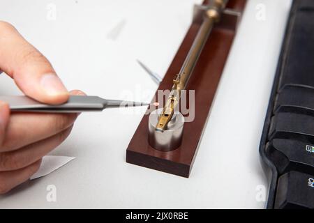 Transmission electron microscope sample holder been loaded with an ...