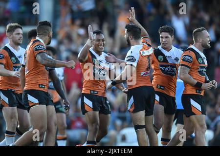 The Tigers celebrate their win over the Warriors during their round 1 ...