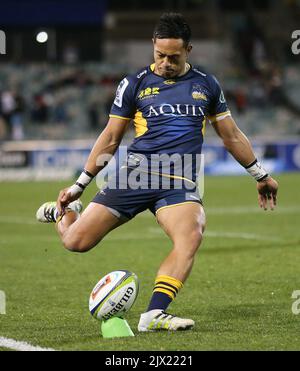 Christian Leali'ifano and Nigel Ah Wong of the Brumbies tackle Samu ...
