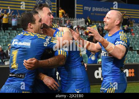 The Eels celebrate Clinton Gutherson's match winning try during their ...