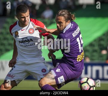 Josh Risdon of the Perth Glory and Jaushua Sotirio of the Western ...