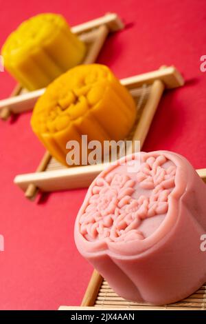 trendy flower shape mooncake on red background with copy space Stock ...