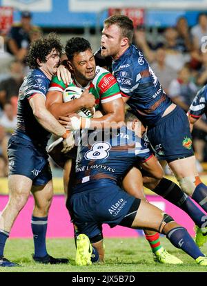 Rabbitohs Zane Musgrave tackled by Cowboys, from left, Jake Granville ...