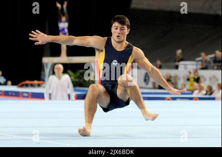 Clay Stephens of South Australia falls during his routine on the Floor ...