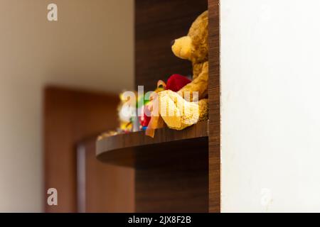 Stuffed toys on a wall shelf Stock Photo - Alamy